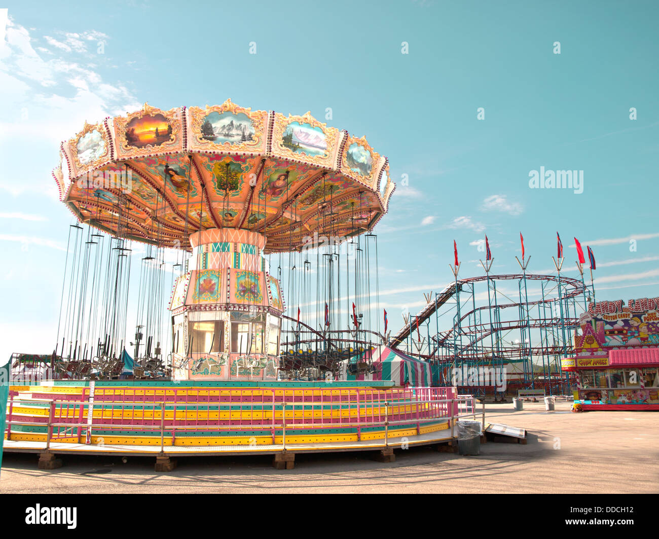 colorful carousel with swings at a fair Stock Photo - Alamy