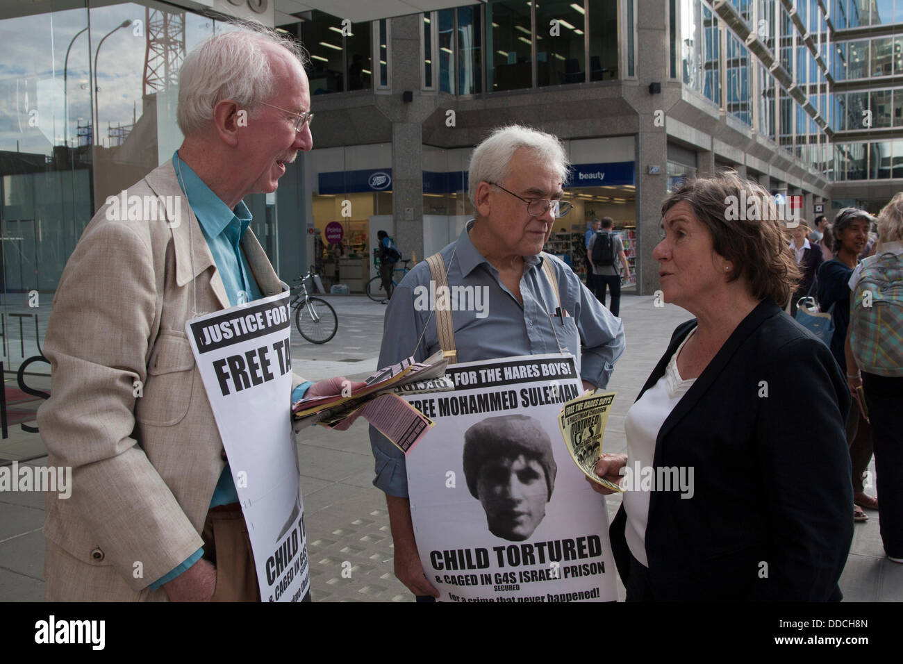 London, UK. 30th Aug, 2013. Baroness Tonge talks to protesters as a ...
