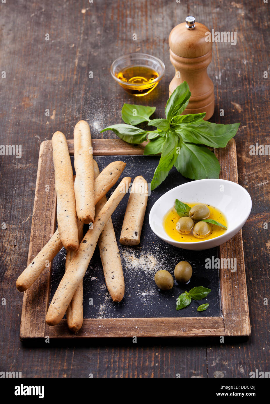Bread sticks on vintage slate chalk board background Stock Photo - Alamy