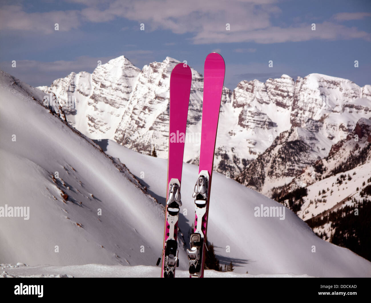 Pink skis stand atop a snowy mountain Stock Photo - Alamy