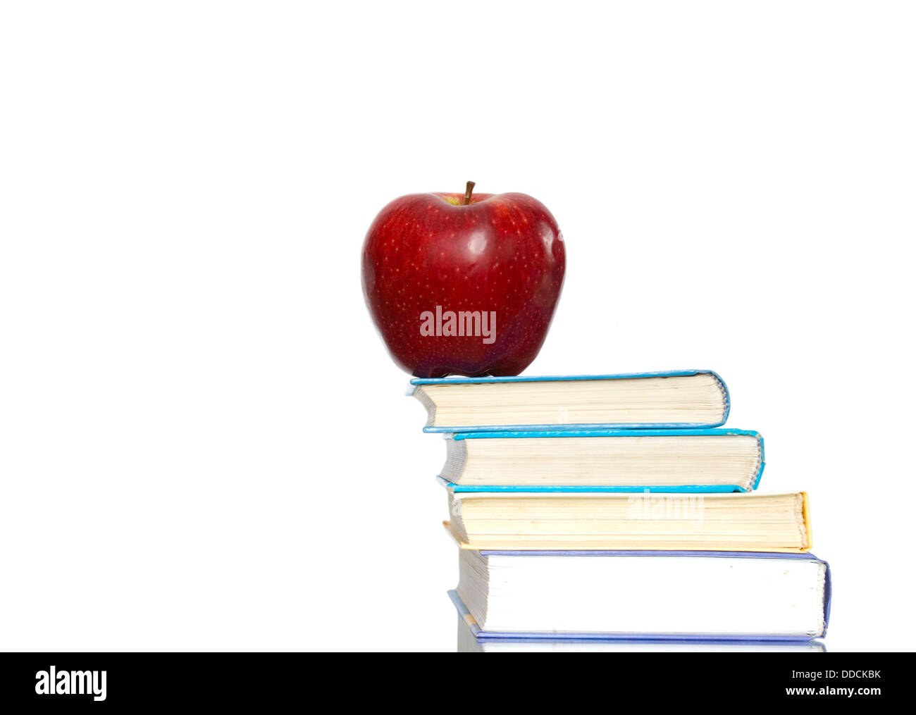 apple on books Stock Photo - Alamy