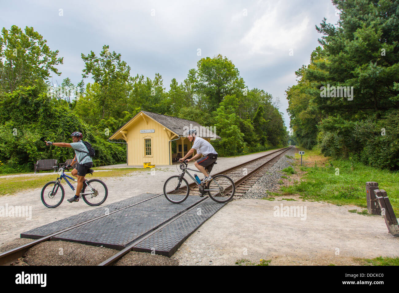 Couple riding bikes across tracks of Cuyahoga Valley Scenic Railroad in ...