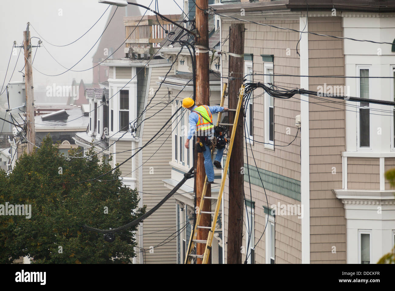 Lineman climbing ladder power pole hi-res stock photography and images ...