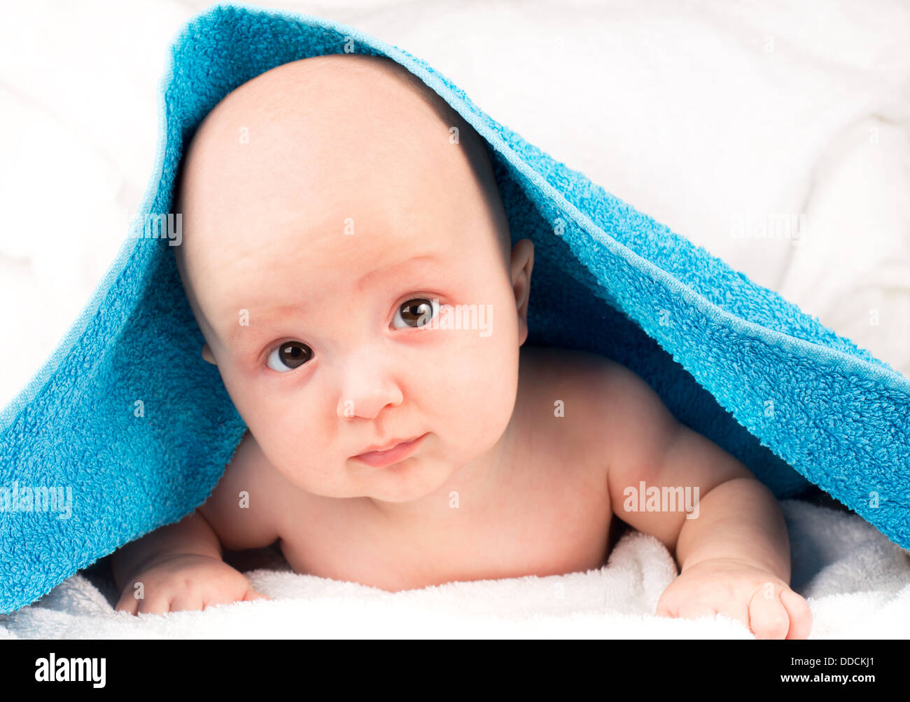 Cute baby lying on towel Stock Photo - Alamy