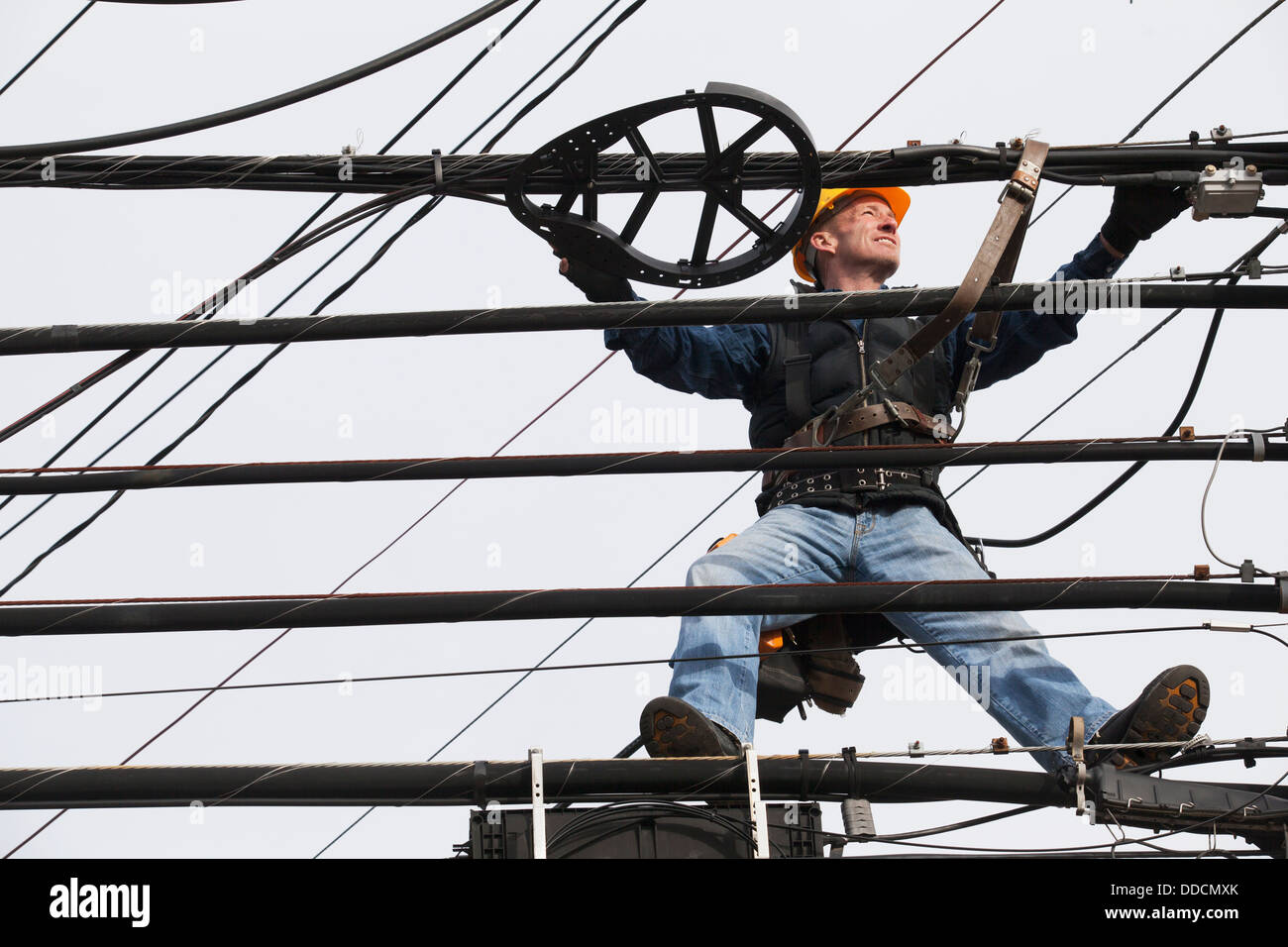 Worker on power pole hi-res stock photography and images - Alamy