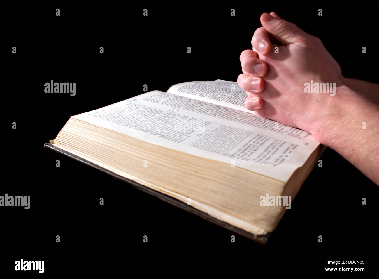 hands on Bible Stock Photo - Alamy