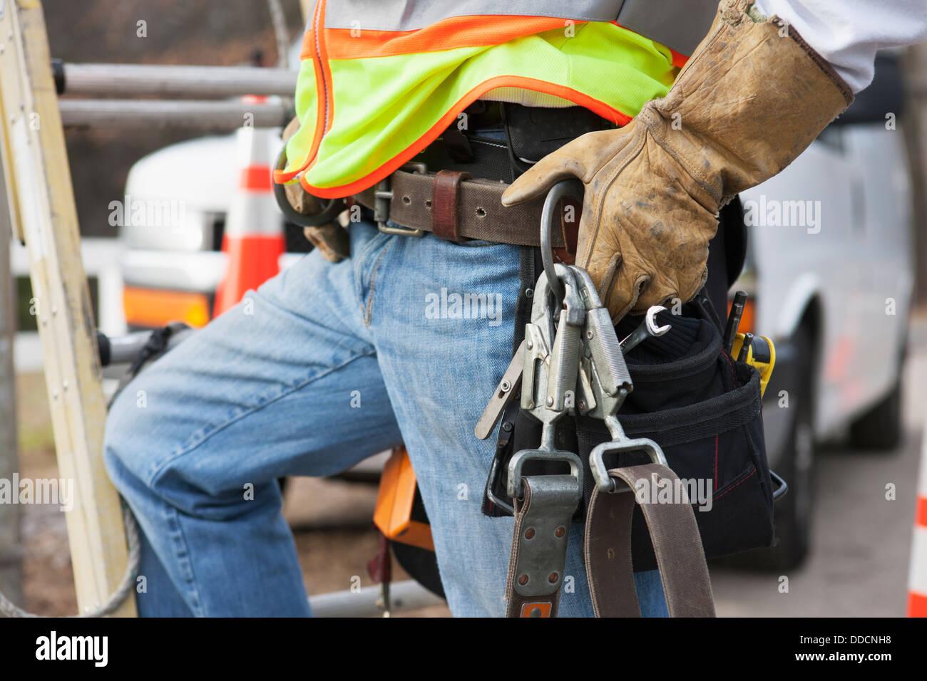 Power line worker with ladder at his truck Stock Photo - Alamy