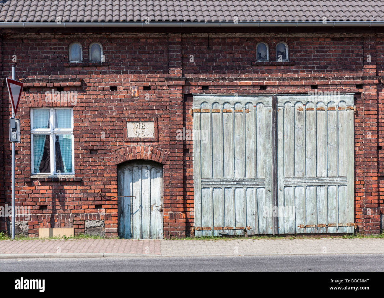 Red brick house with wooden doors in the Sorbian village of Nissen ...