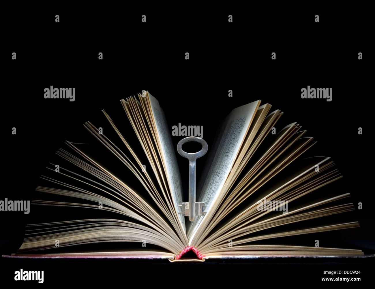 Key and book Stock Photo - Alamy