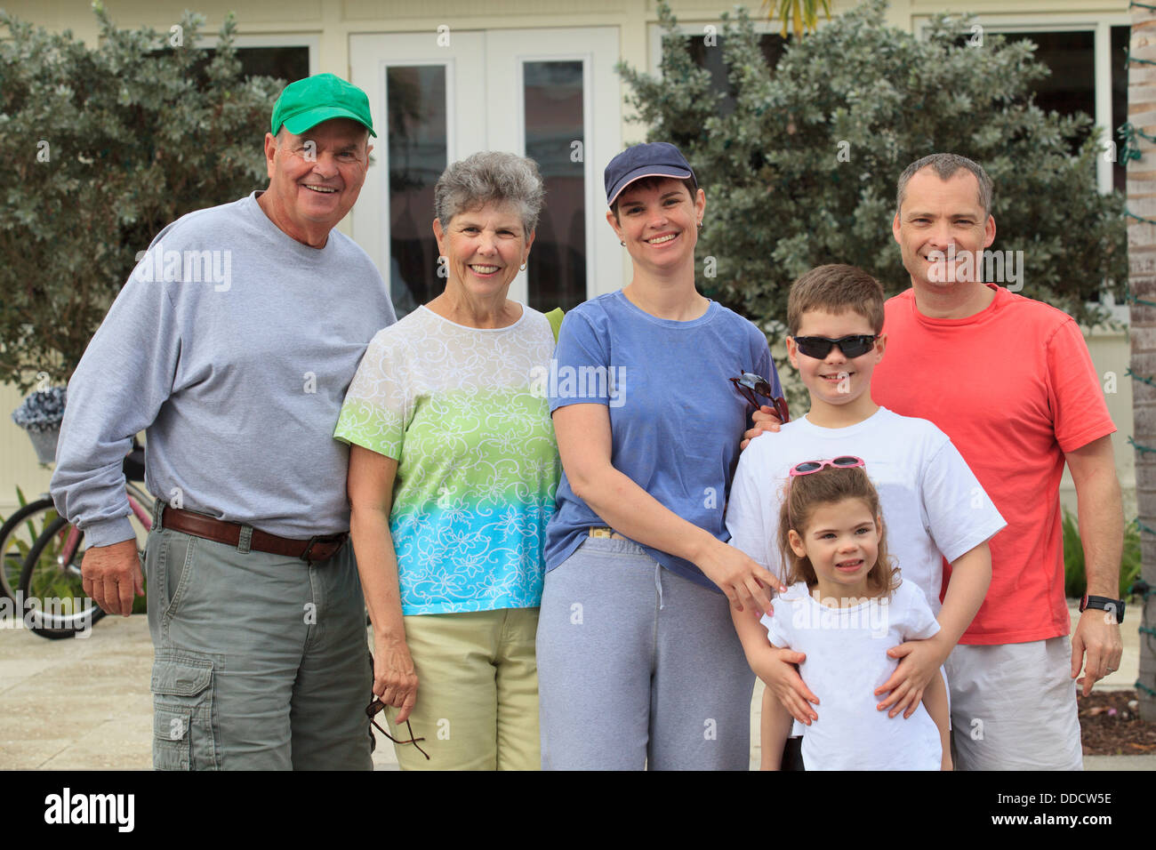 Portrait of an extended family smiling Stock Photo - Alamy