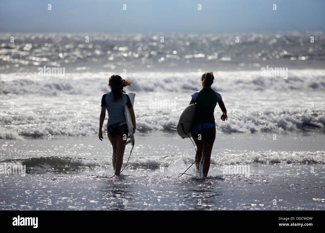 Two Surfer Girls Stock Photo - Alamy