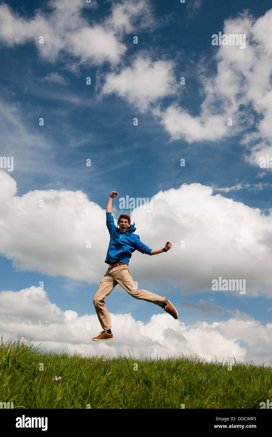 Happy jumping man Stock Photo - Alamy