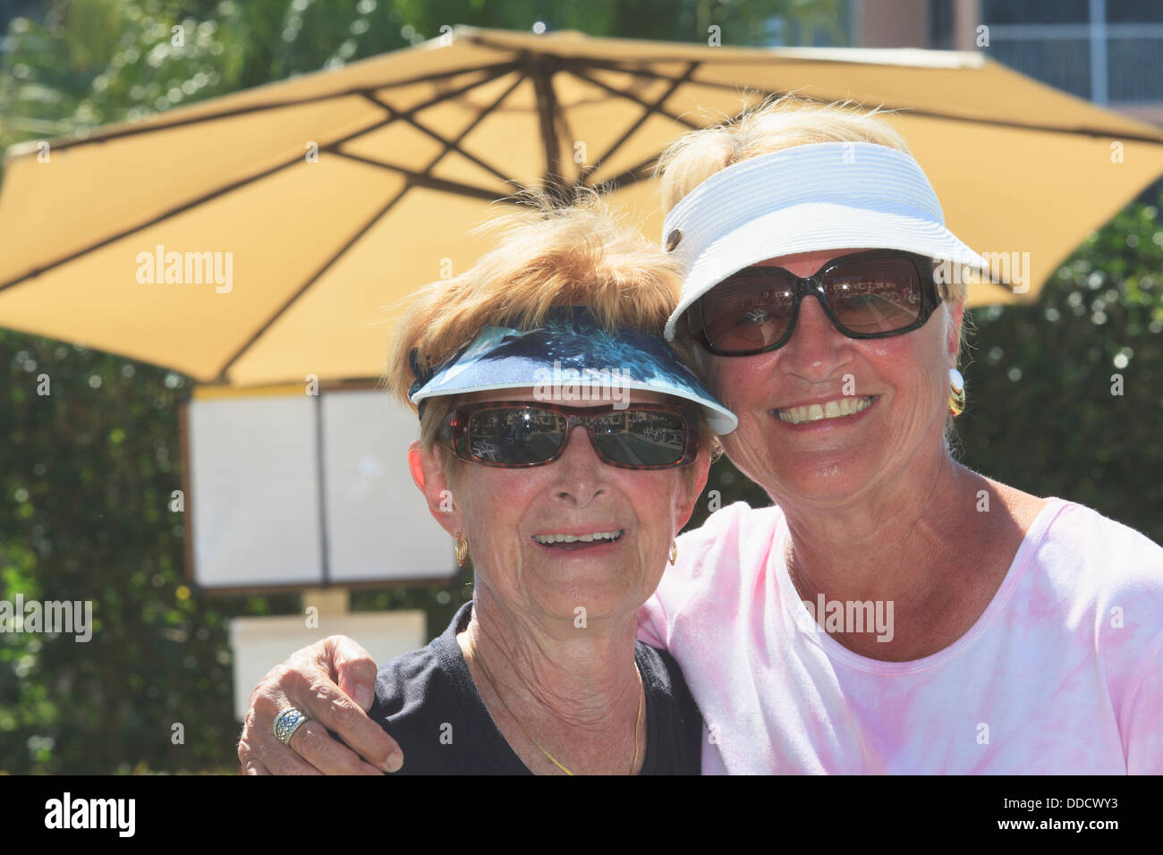 Senior friends smiling Stock Photo - Alamy