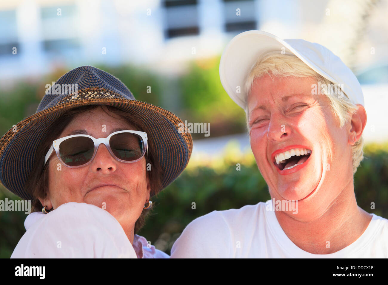 Female friends smiling Stock Photo - Alamy