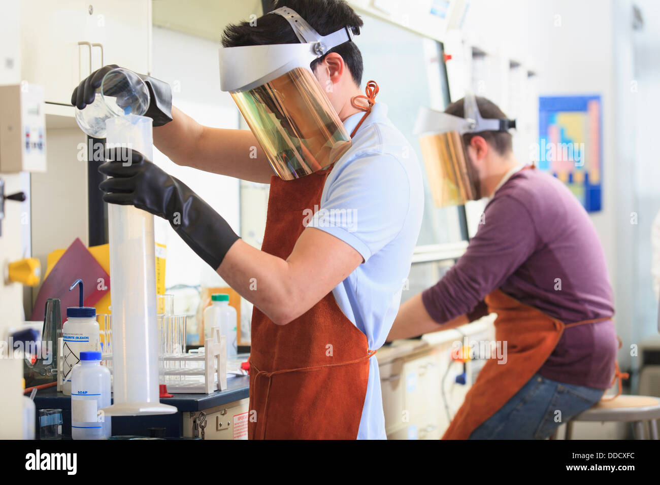 Student wearing protective apron in science lab hi-res stock ...