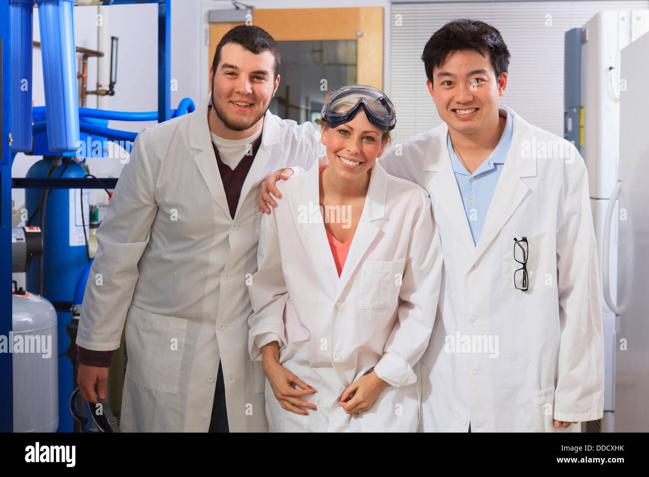 Engineering students smiling in water ultra purification system room in ...