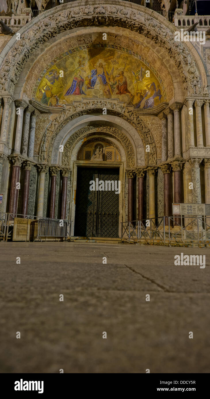 Religious painting on the front door of St. Marco Church, Venice Italy ...