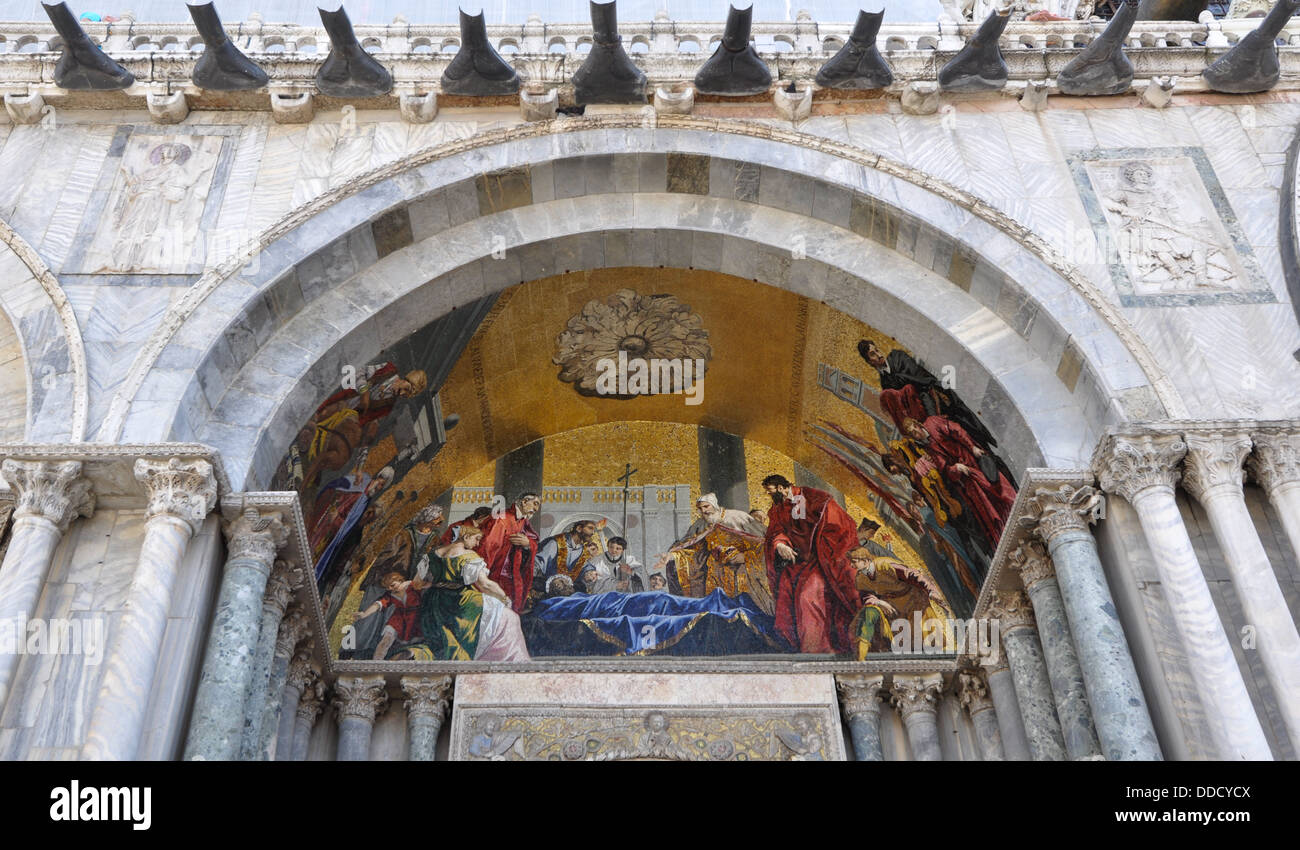 Religious painting on the front door of St. Marco Church, Venice Italy ...