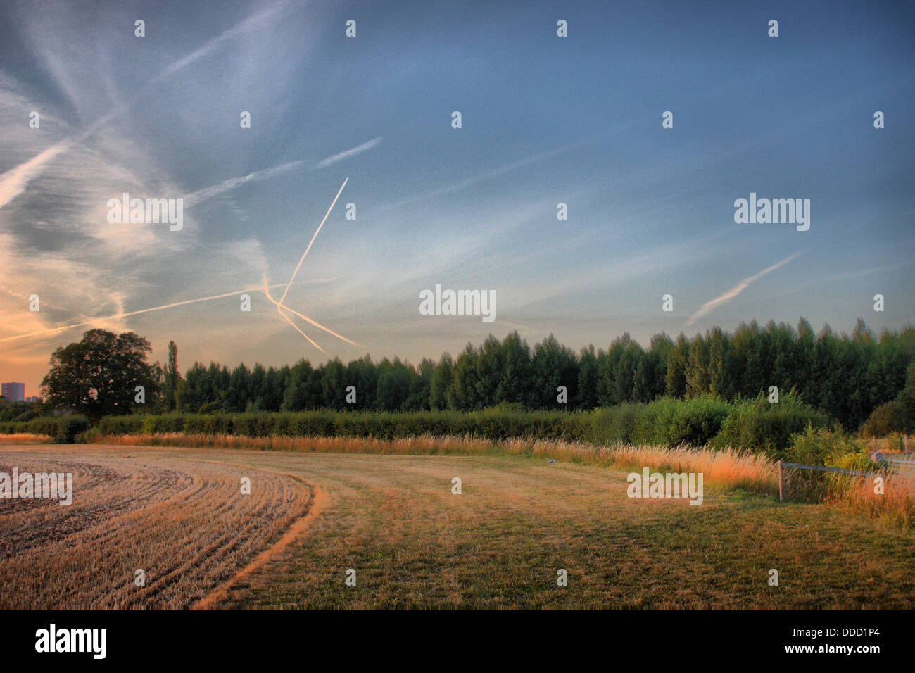 Whispy clouds in the sky over rural countryside scene at sunset Stock ...
