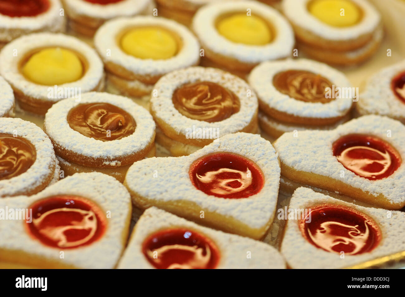 A display of round and heart shaped pastries Stock Photo - Alamy