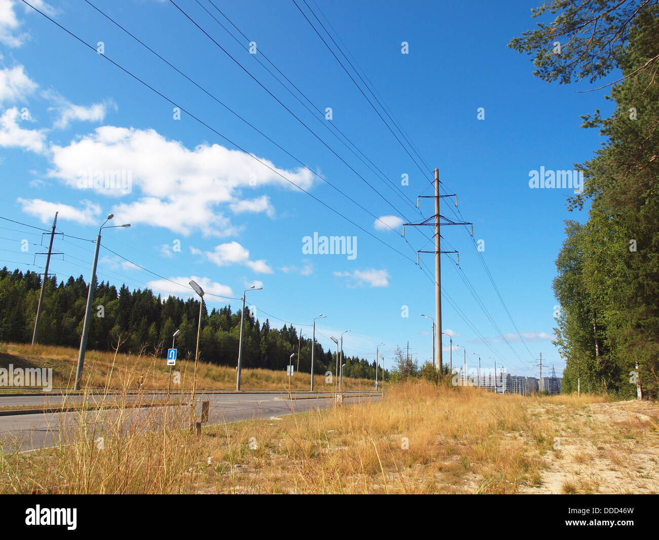 Electric main above road Stock Photo - Alamy