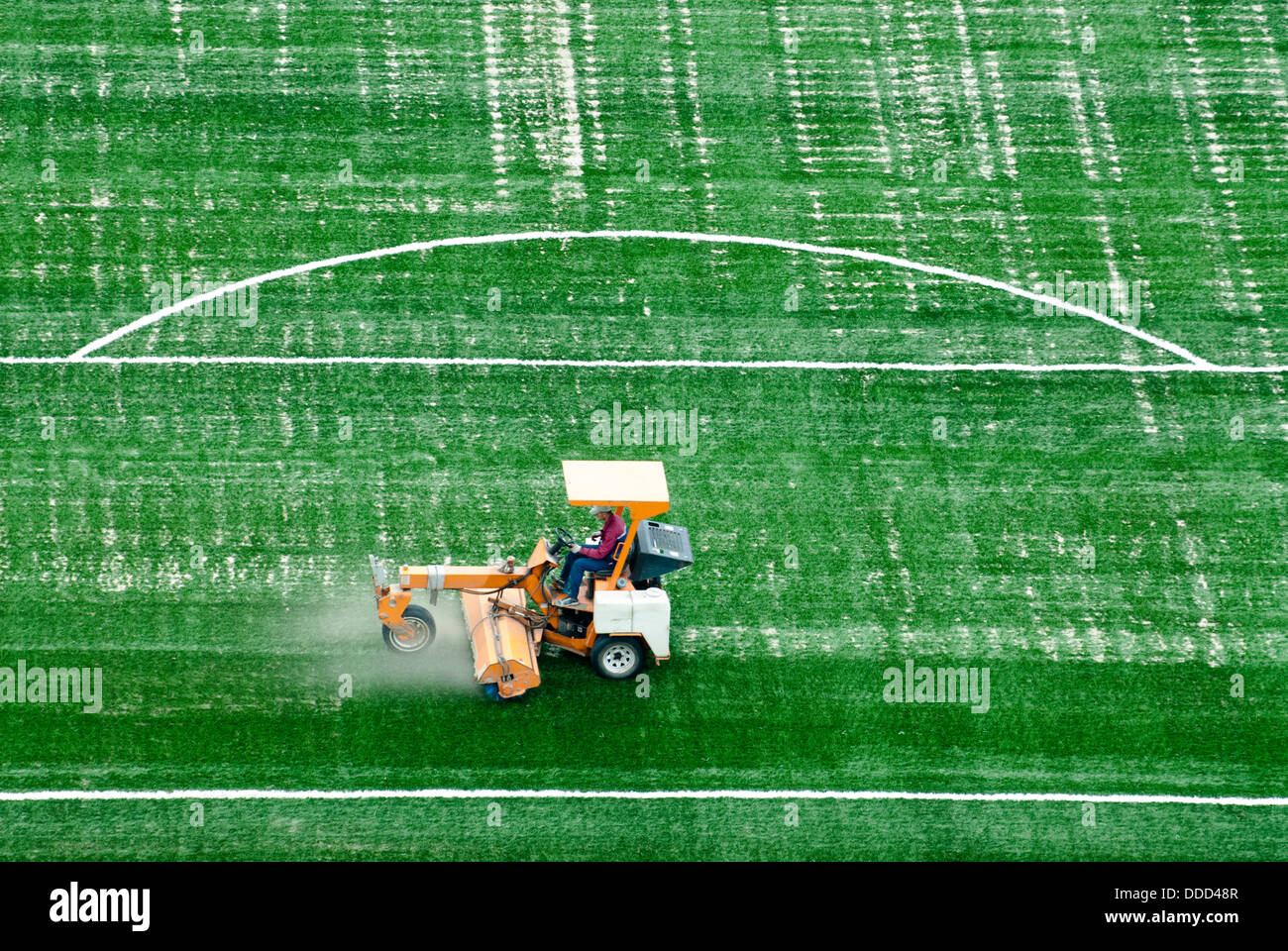 Treatment of the artificial turf of the football pitch with special ...