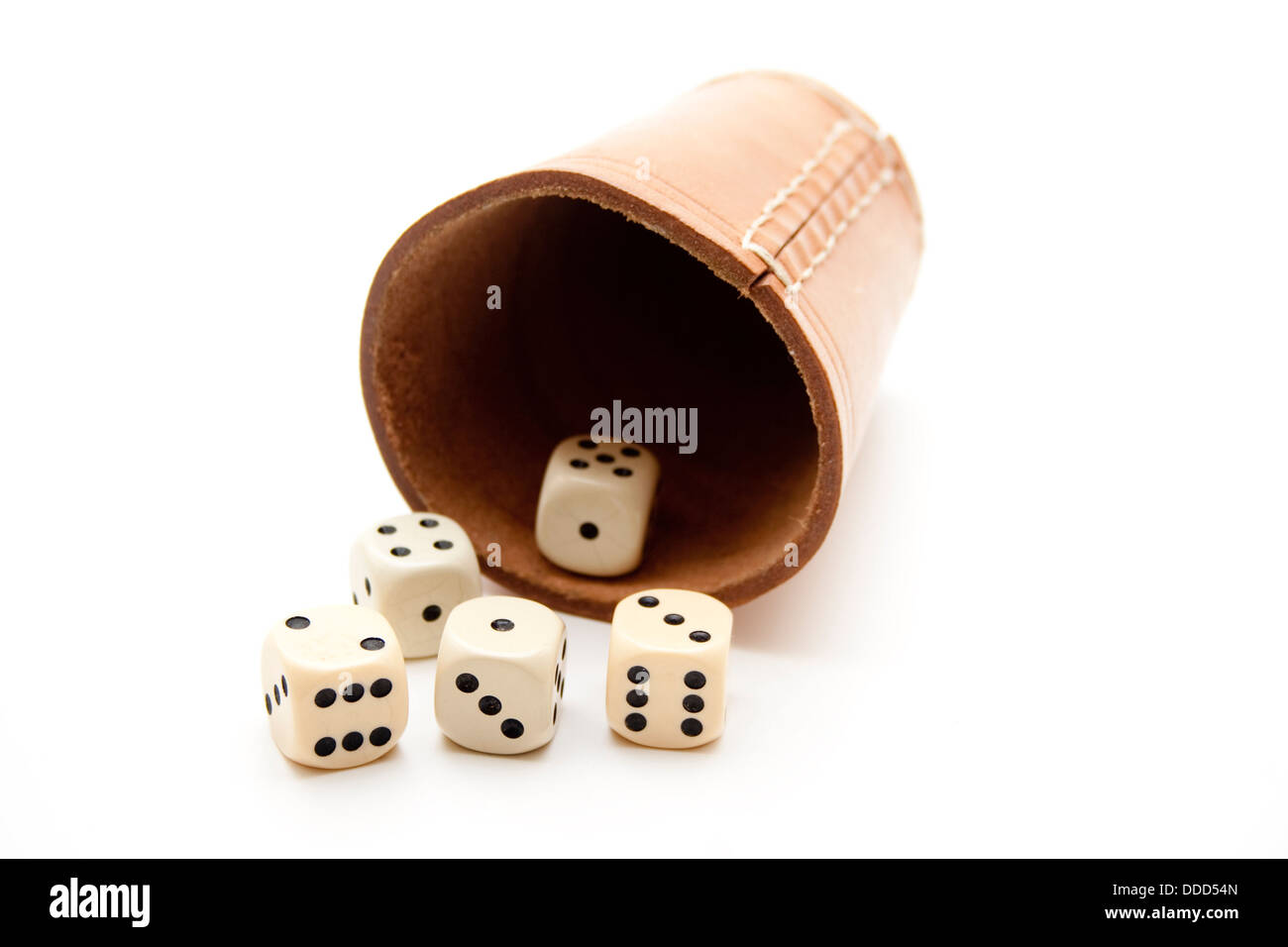 Dice cup with cube Stock Photo - Alamy