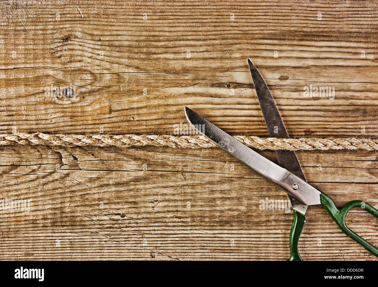 old tailor scissors and rope on the wooden background Stock Photo - Alamy
