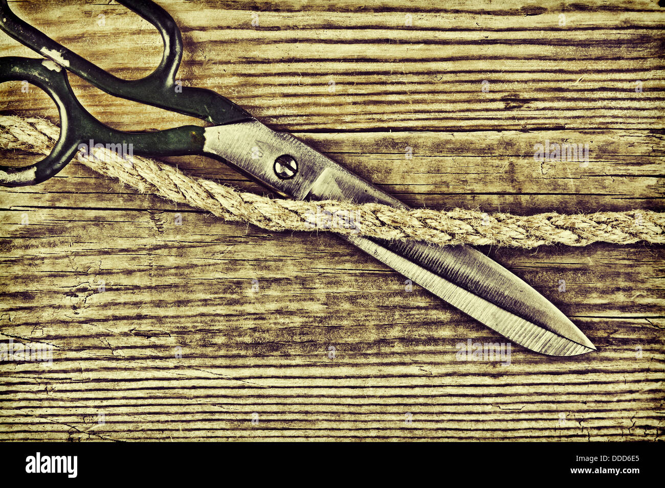 old tailor scissors and rope on the wooden background Stock Photo - Alamy