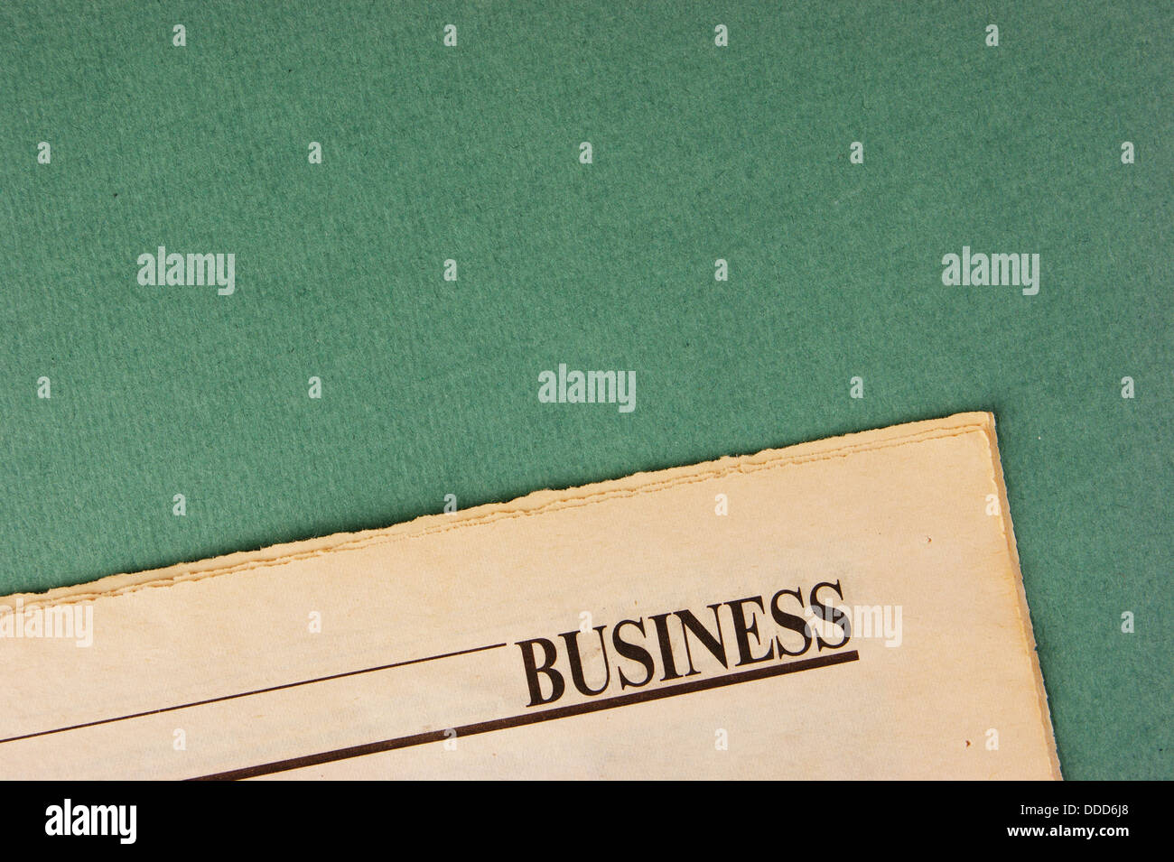 old newspaper on a green background Stock Photo - Alamy