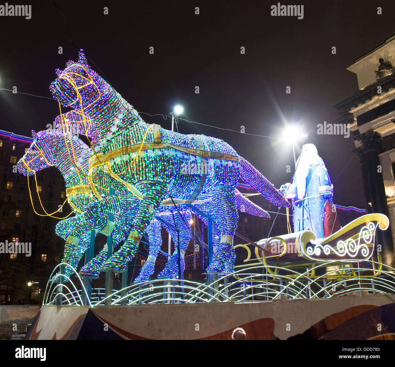 Electric sculptures of Santa Claus in carriage with horses on street in ...