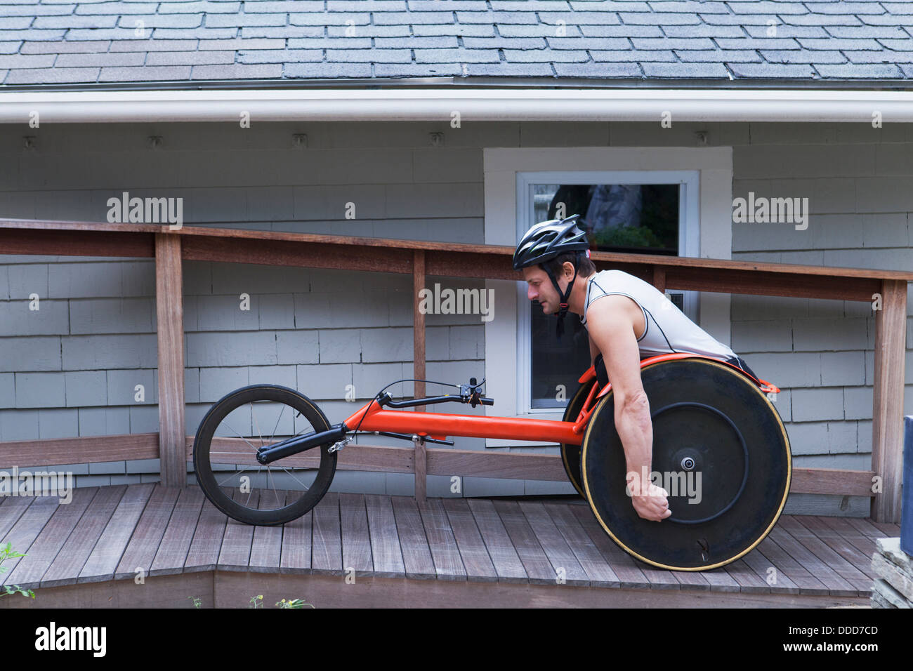 Man with spinal cord injury in disability racing bike Stock Photo - Alamy