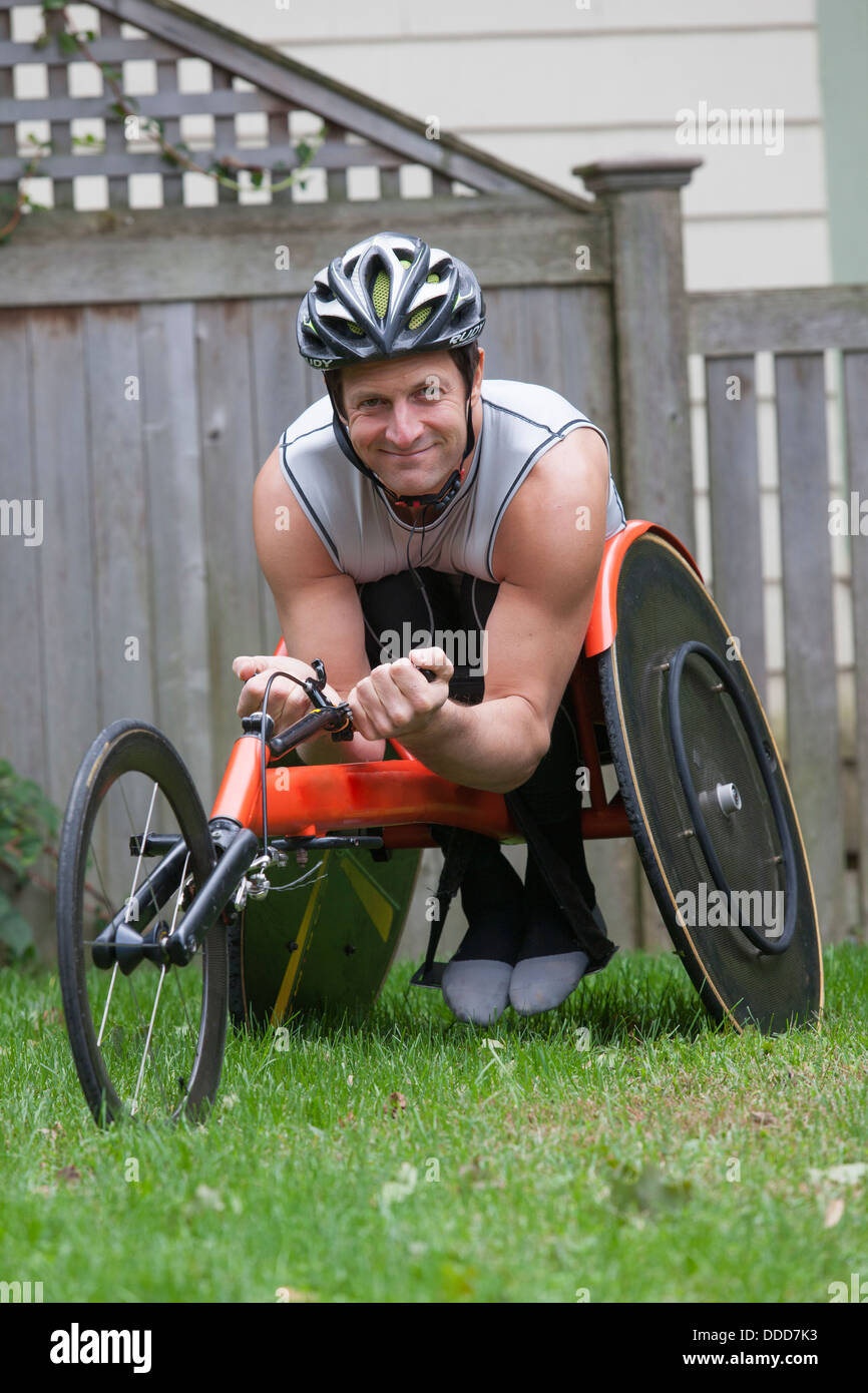 Man with spinal cord injury in disability racing bike Stock Photo - Alamy