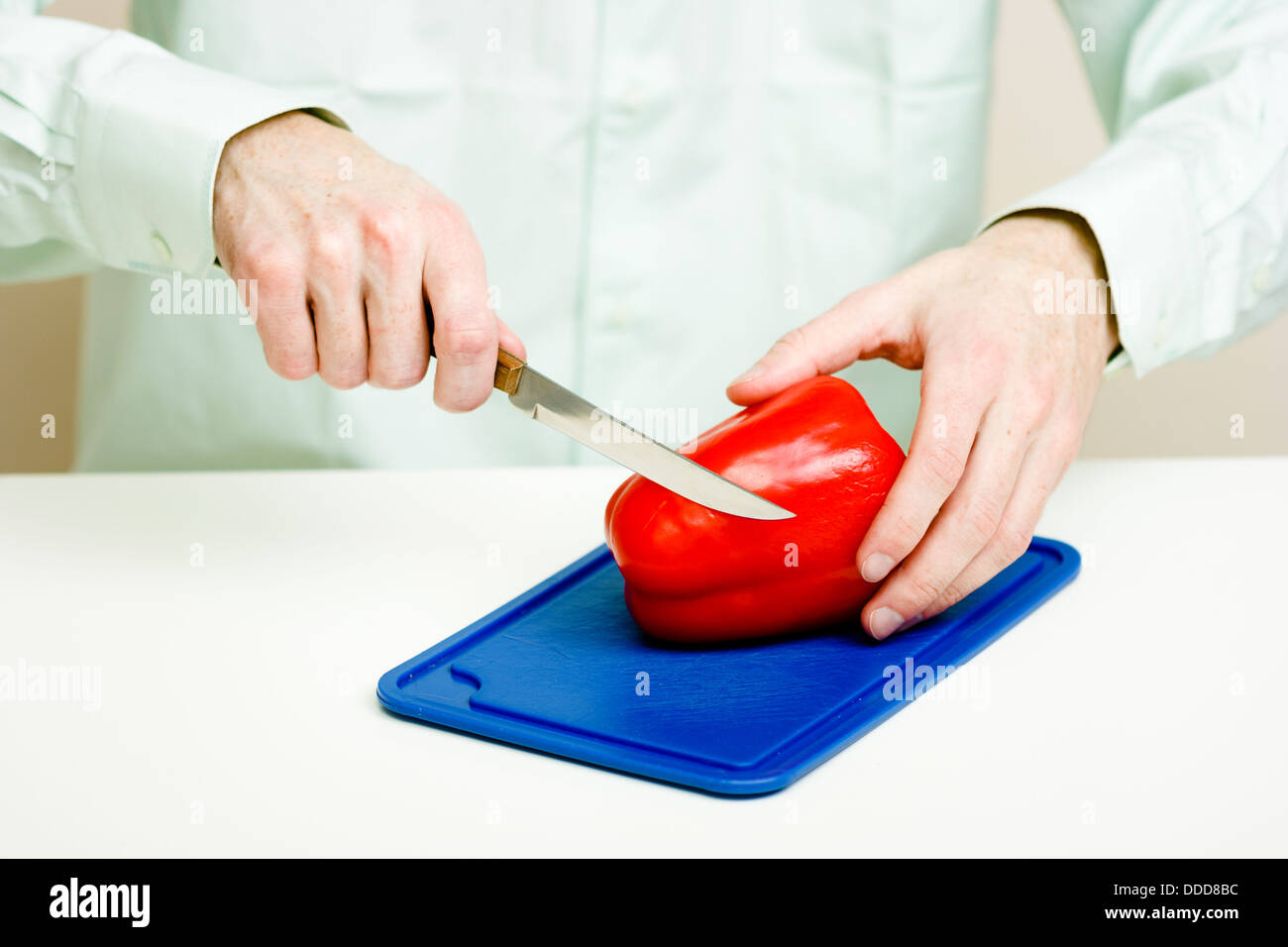 Person hands knife cutting hi-res stock photography and images - Alamy