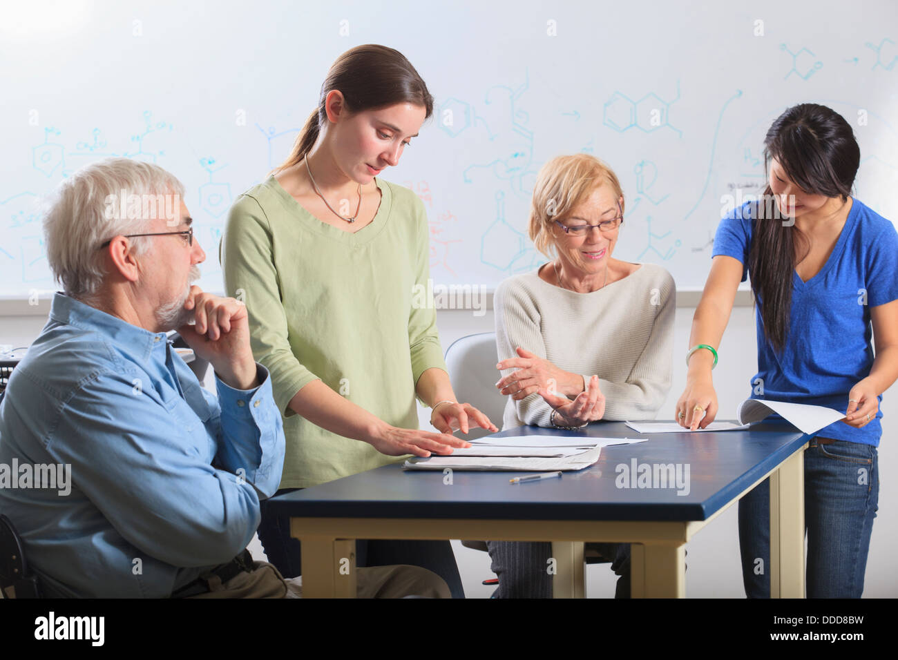 Professors tutoring students one professor in a wheelchair with ...