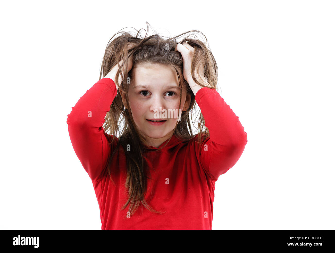 Disheveled frightened girl child on a white background Stock Photo - Alamy