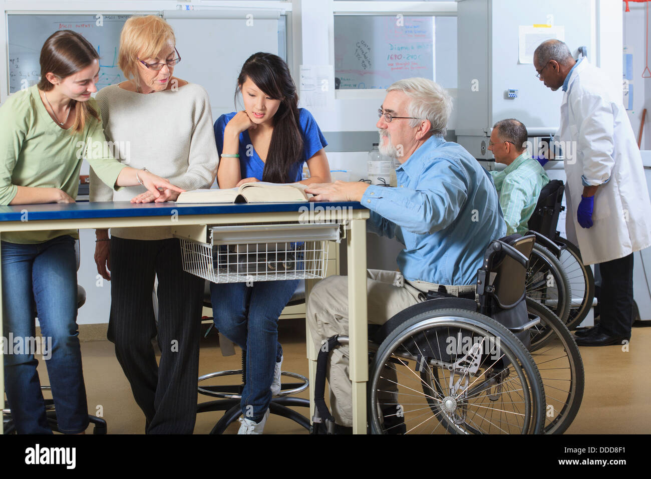 Professors and students working together in a chemistry lab Stock Photo ...