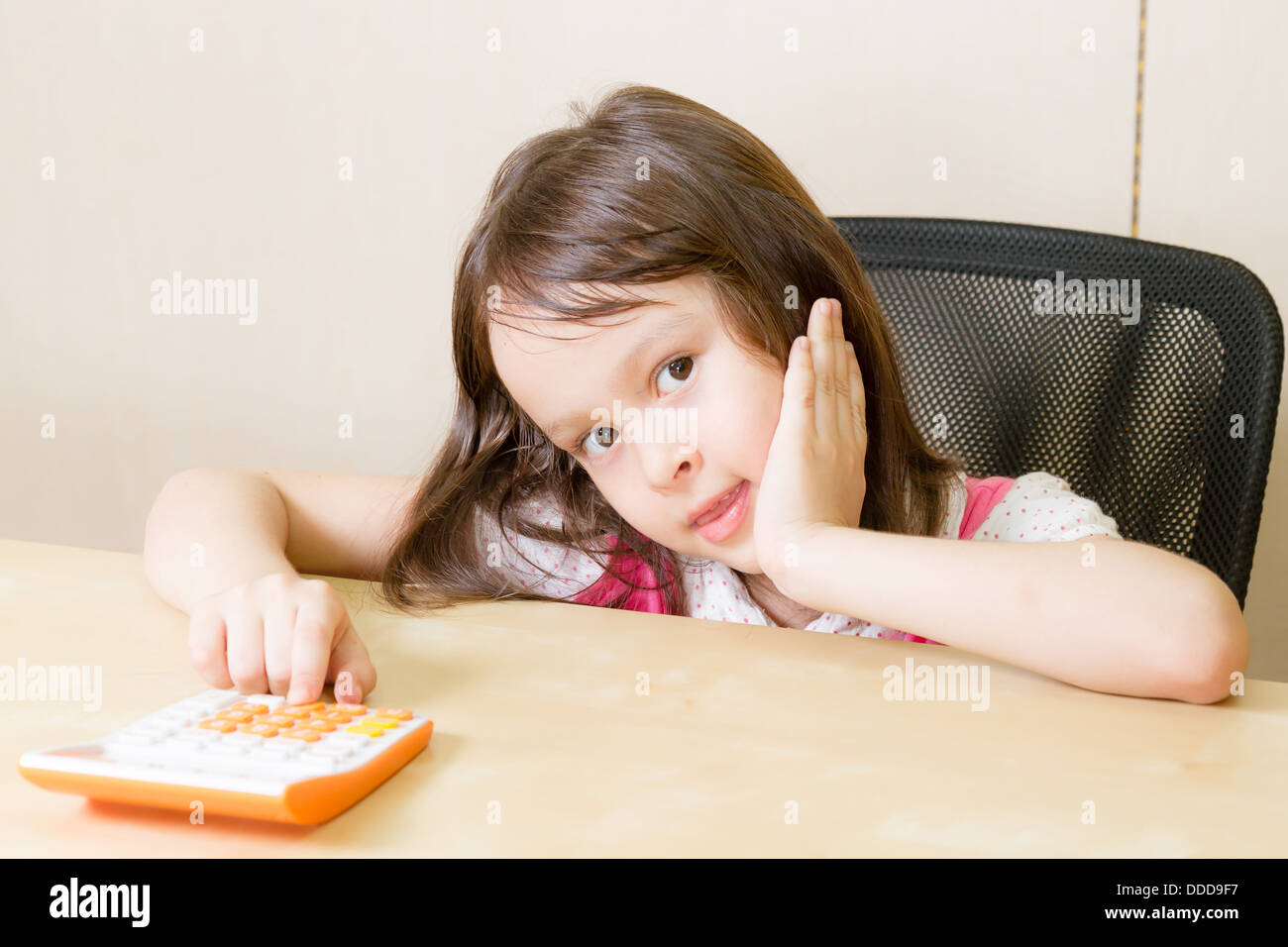 Child with calculator in corporate office Stock Photo - Alamy