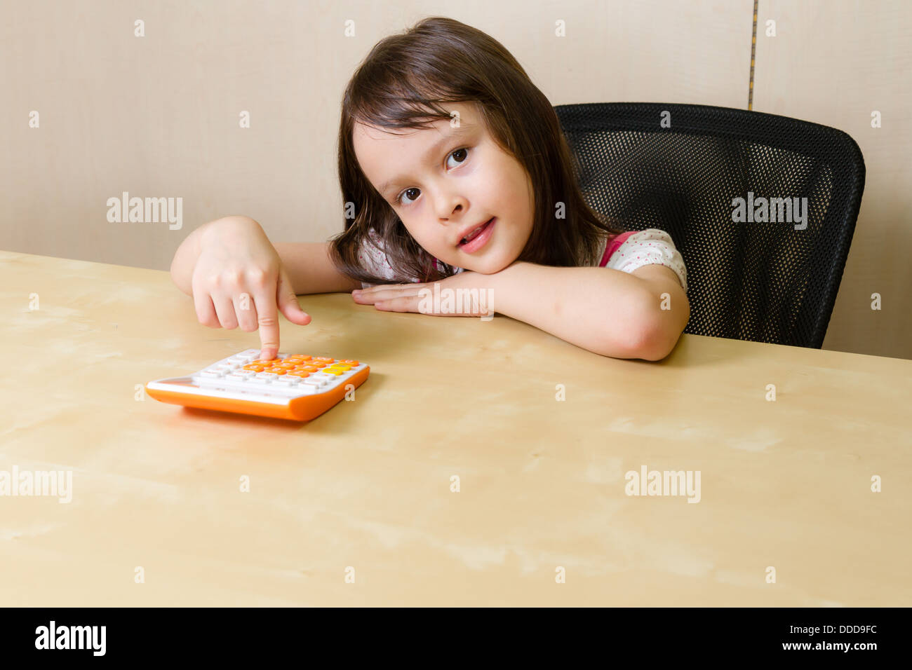 Child with calculator in corporate office Stock Photo - Alamy