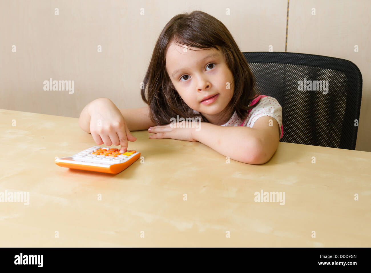 Child with calculator in corporate office Stock Photo - Alamy