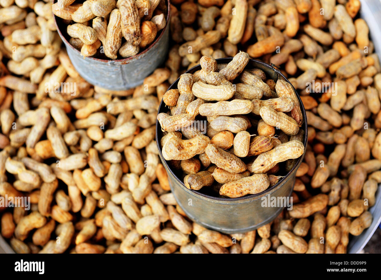Two tin cans of peanut Stock Photo - Alamy