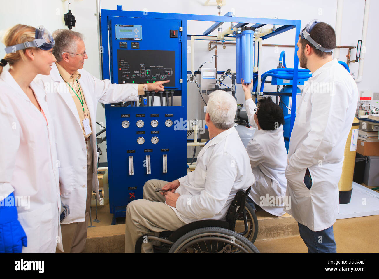Professors explaining operation of water ultra purification system and ...