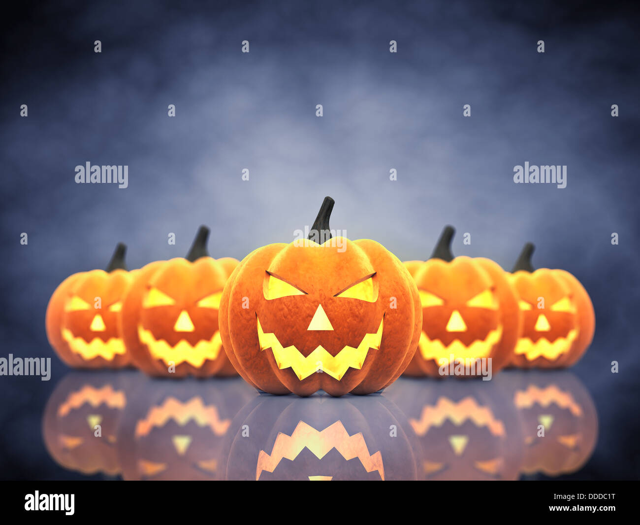 Halloween carved pumpkins on blue background Stock Photo - Alamy