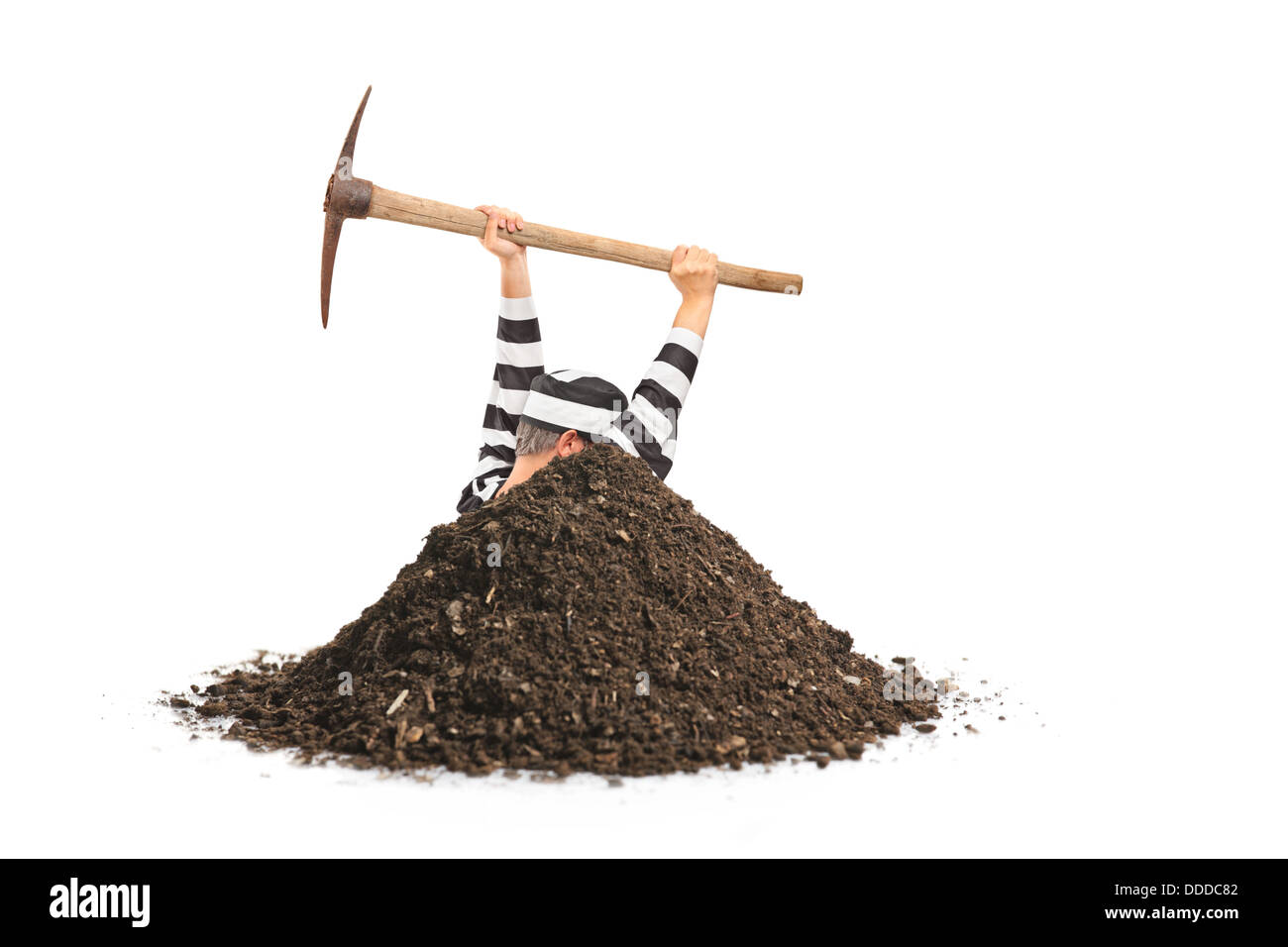 Male prisoner digging a hole and trying to escape Stock Photo - Alamy