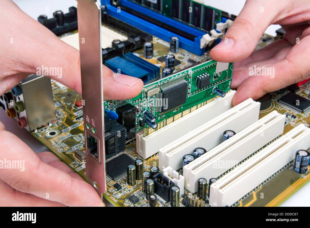 Man installing LAN networdk adapter into PC Stock Photo - Alamy