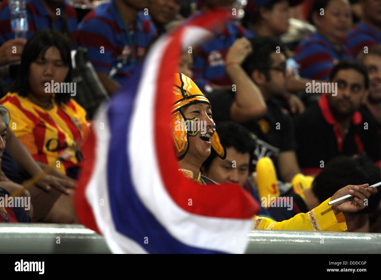 Thailand football fans cheering at Rajmalanga Stadium in Bangkok ...