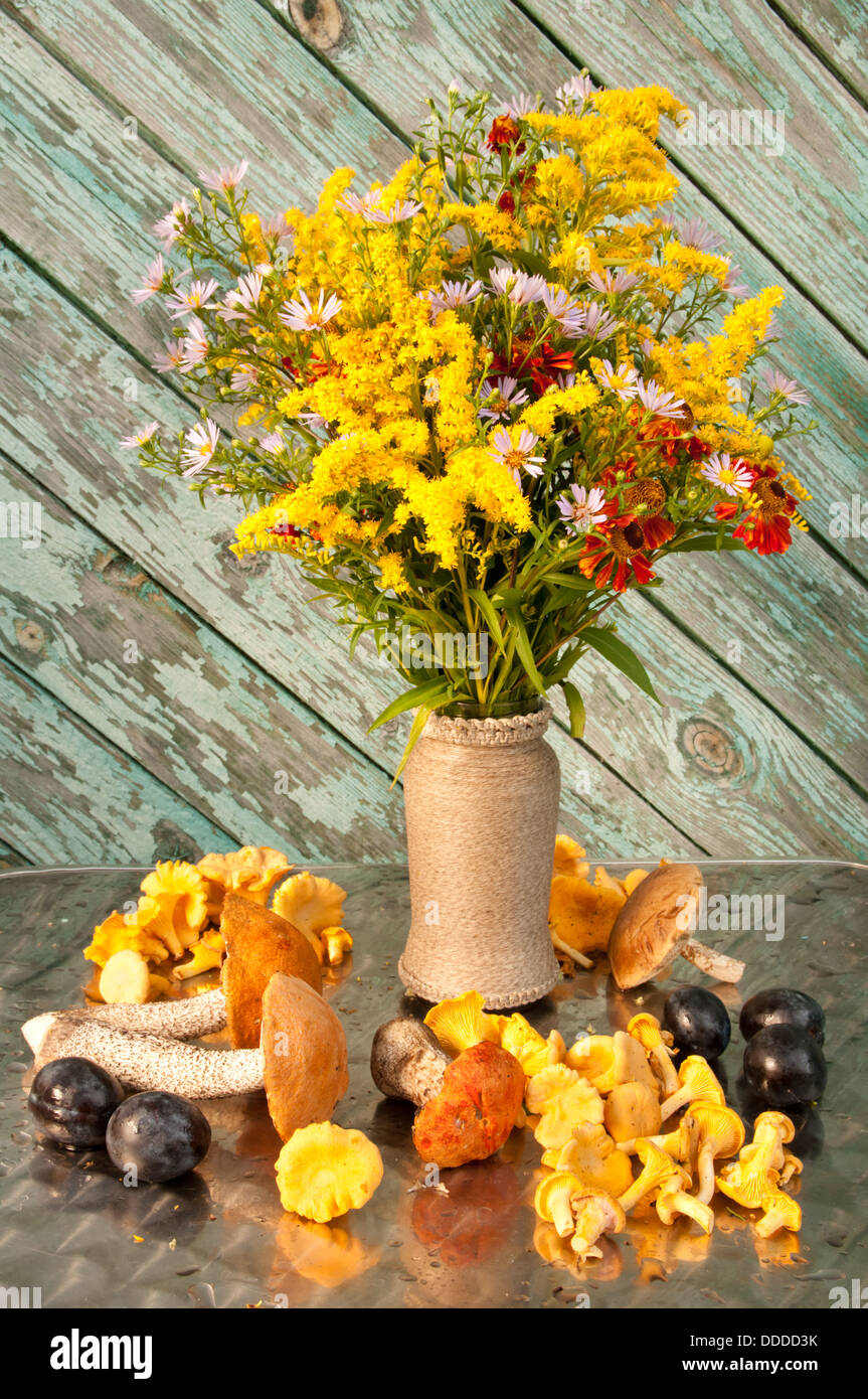 still life of yellow flowers bouquet with mushrooms Stock Photo - Alamy