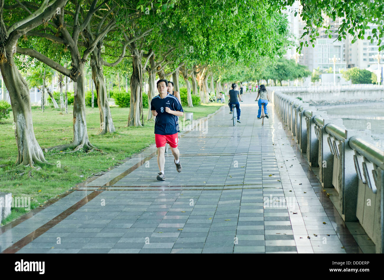Chinese man jogging Stock Photo - Alamy