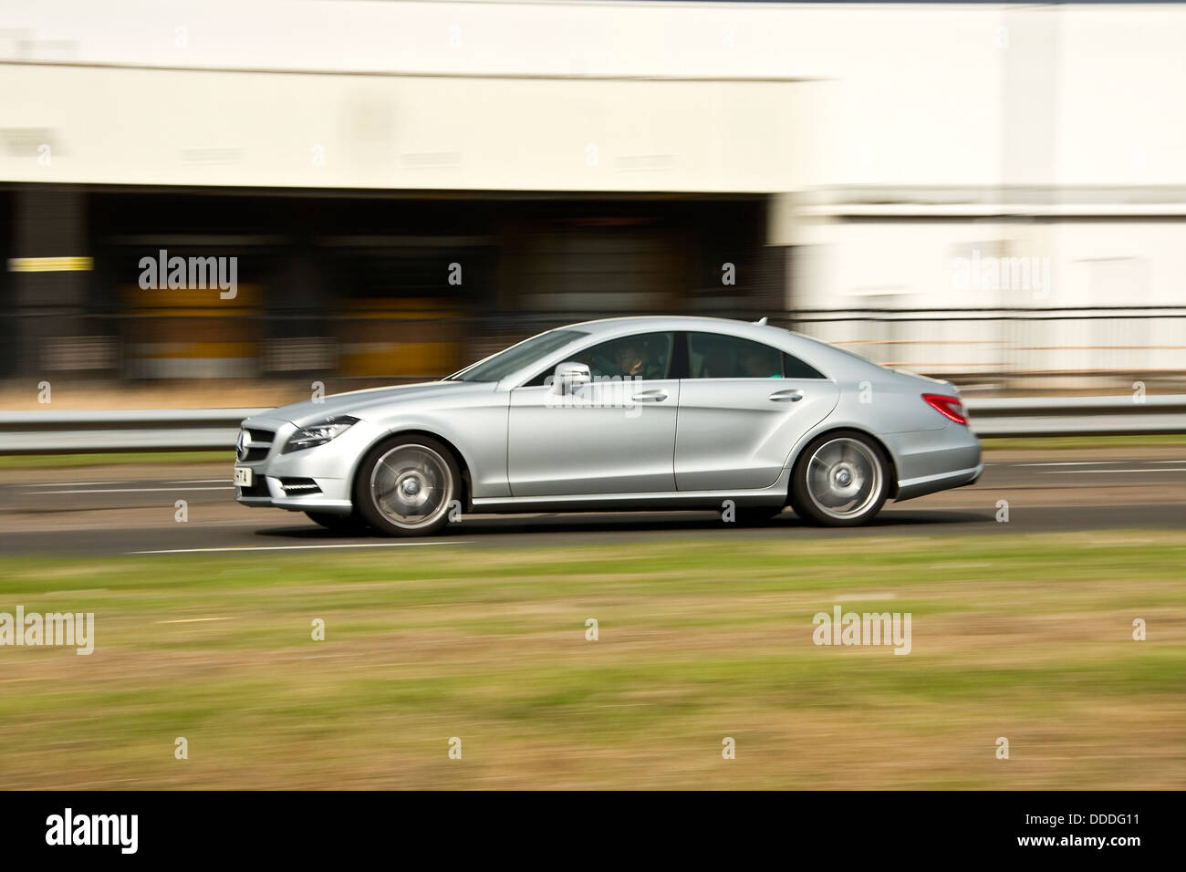 Rear sync flash technique used to capture a classy silver Mercedes Benz ...