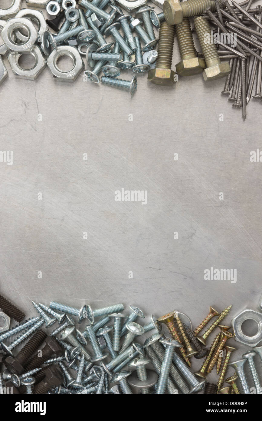 metal construction hardware tool on metal texture Stock Photo - Alamy